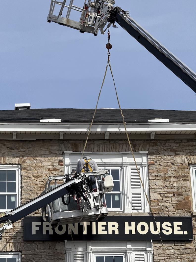 PHOTOS + VIDEO: Watch the Frontier House get a new sign